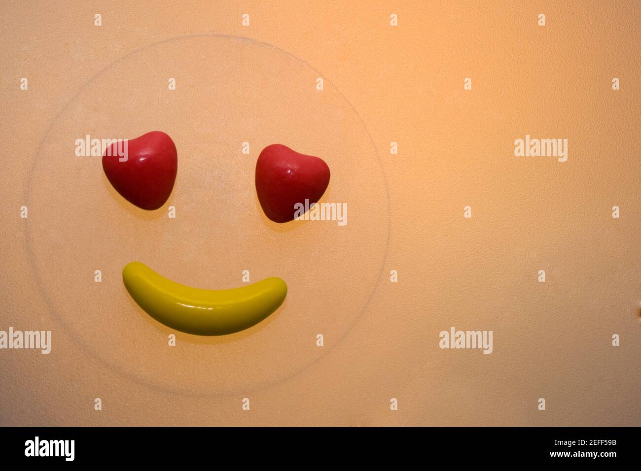 Candy depicting a smiling face Stock Photo - Alamy