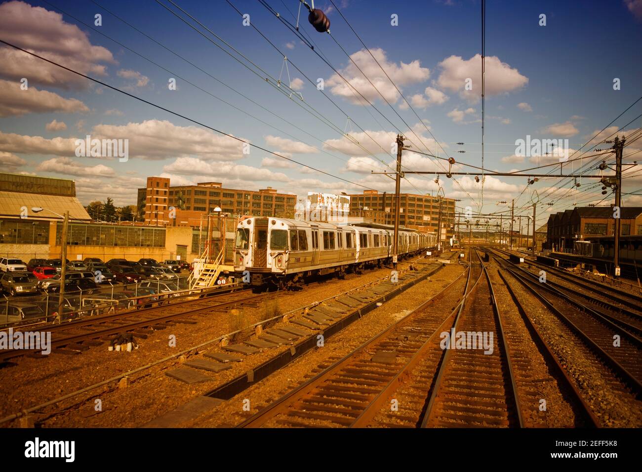 Train on railroad track Stock Photo - Alamy