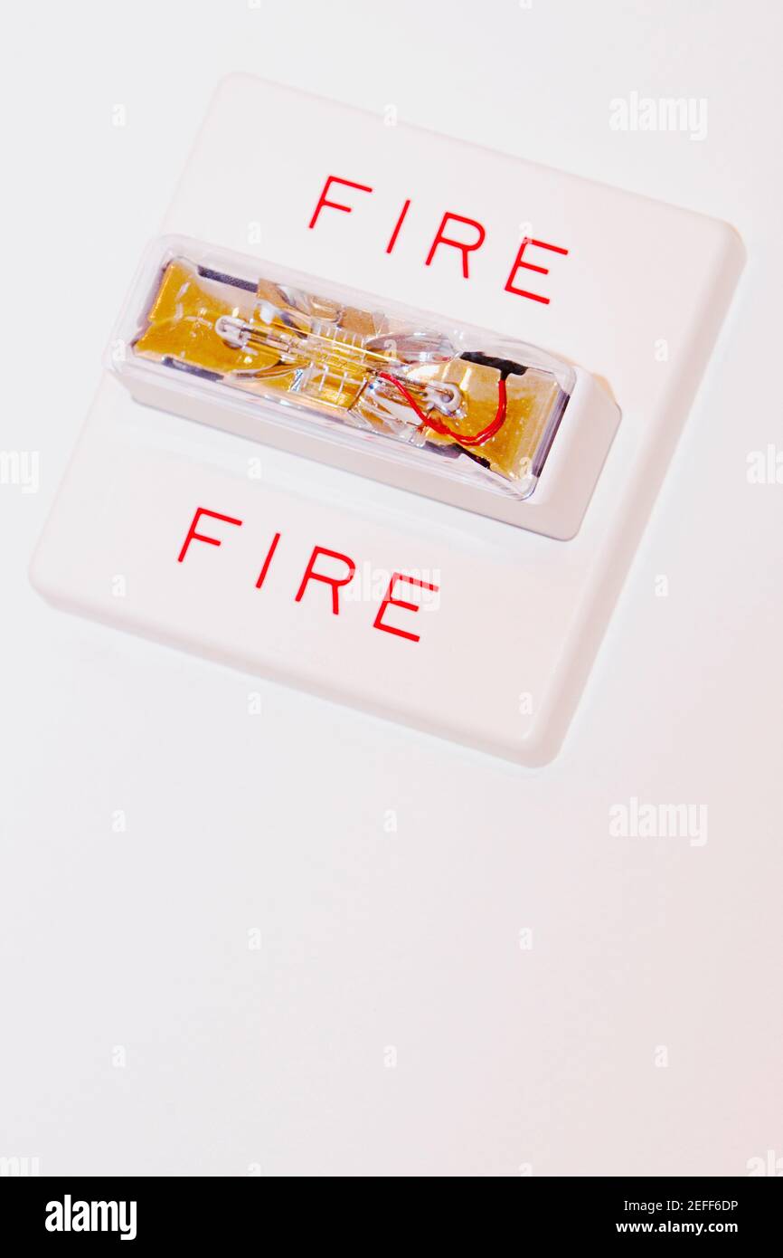 Close-up of a fire alarm on a wall Stock Photo - Alamy