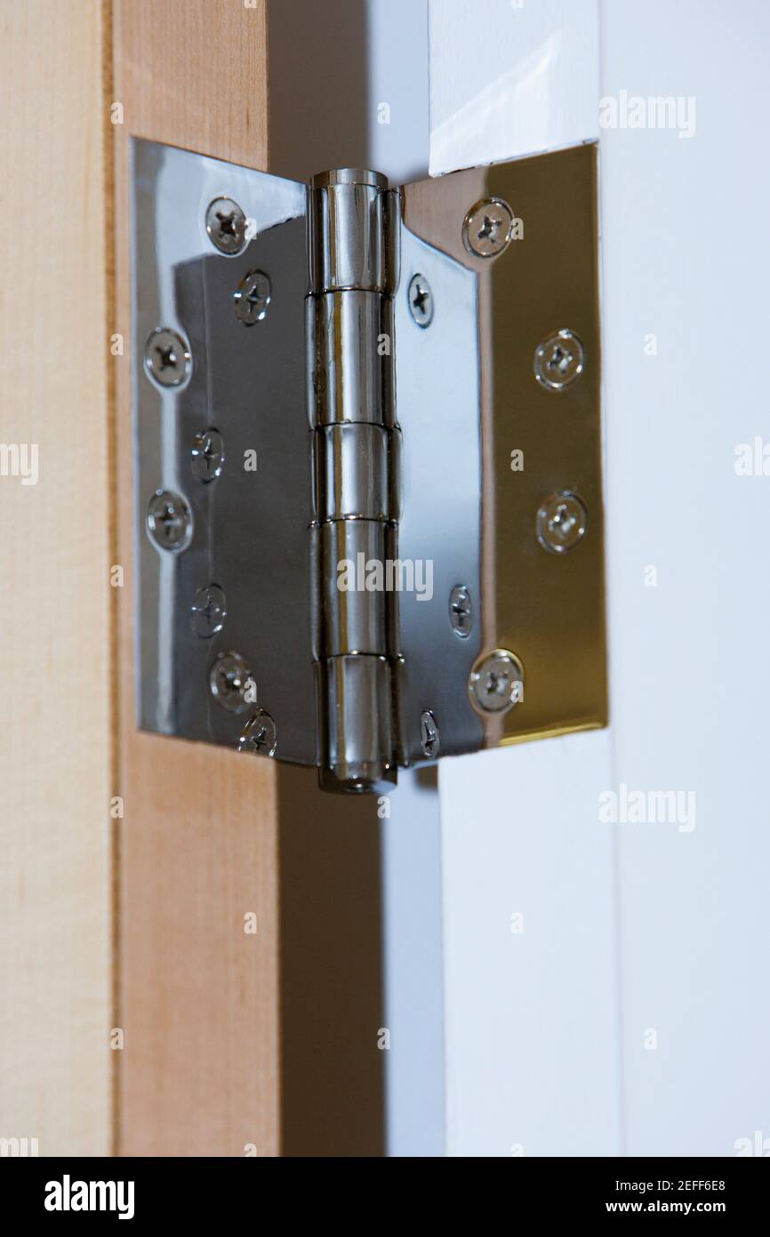 Close-up of the hinge on a door Stock Photo - Alamy