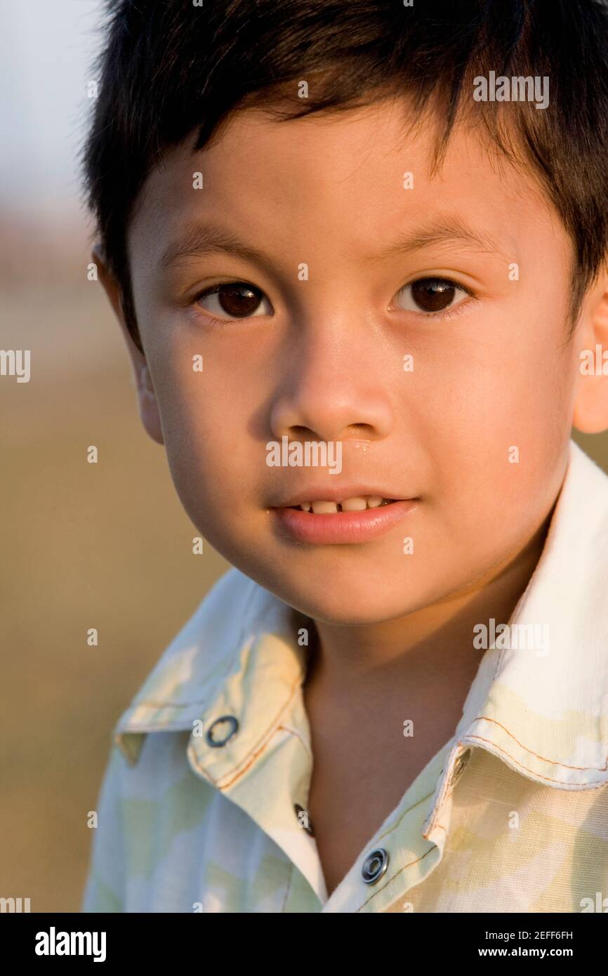 Portrait of a boy grinning Stock Photo - Alamy