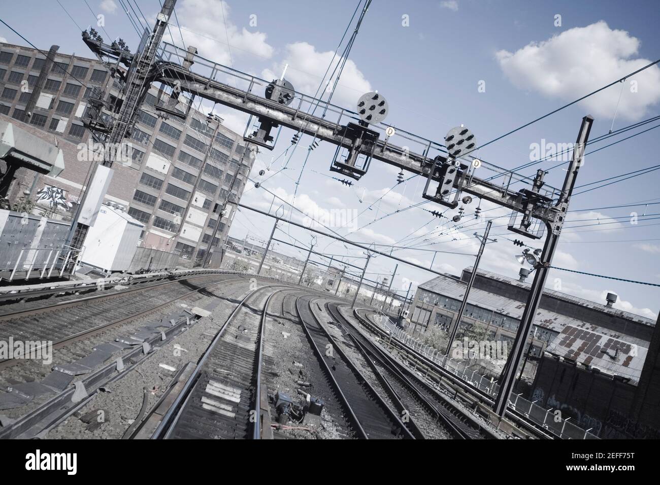Power cables over railroad tracks Stock Photo - Alamy