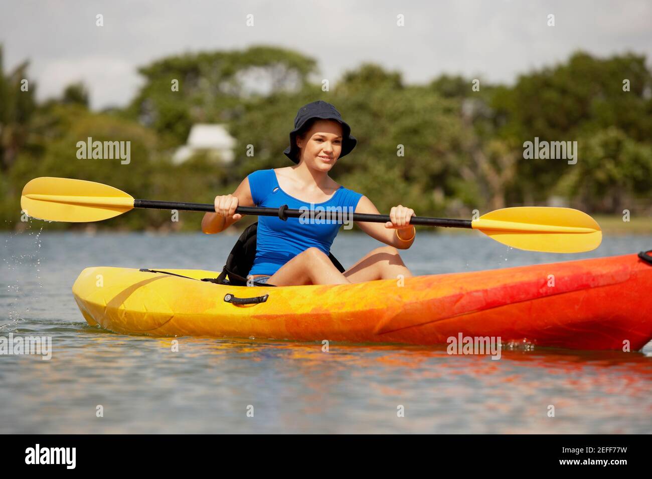 Teenage girl kayaking Stock Photo - Alamy