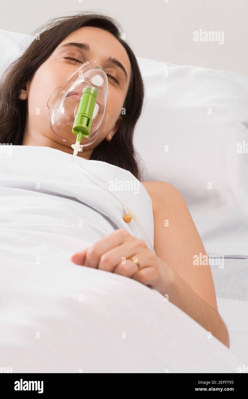 High angle view of a female patient wearing an oxygen mask Stock Photo ...