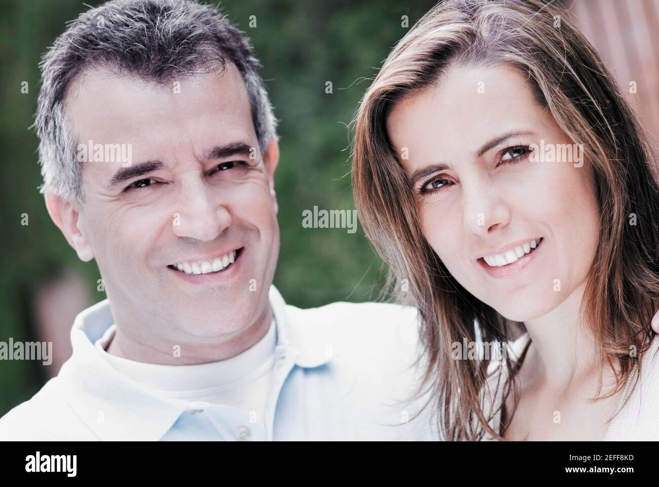 Portrait of a mid adult couple smiling Stock Photo - Alamy