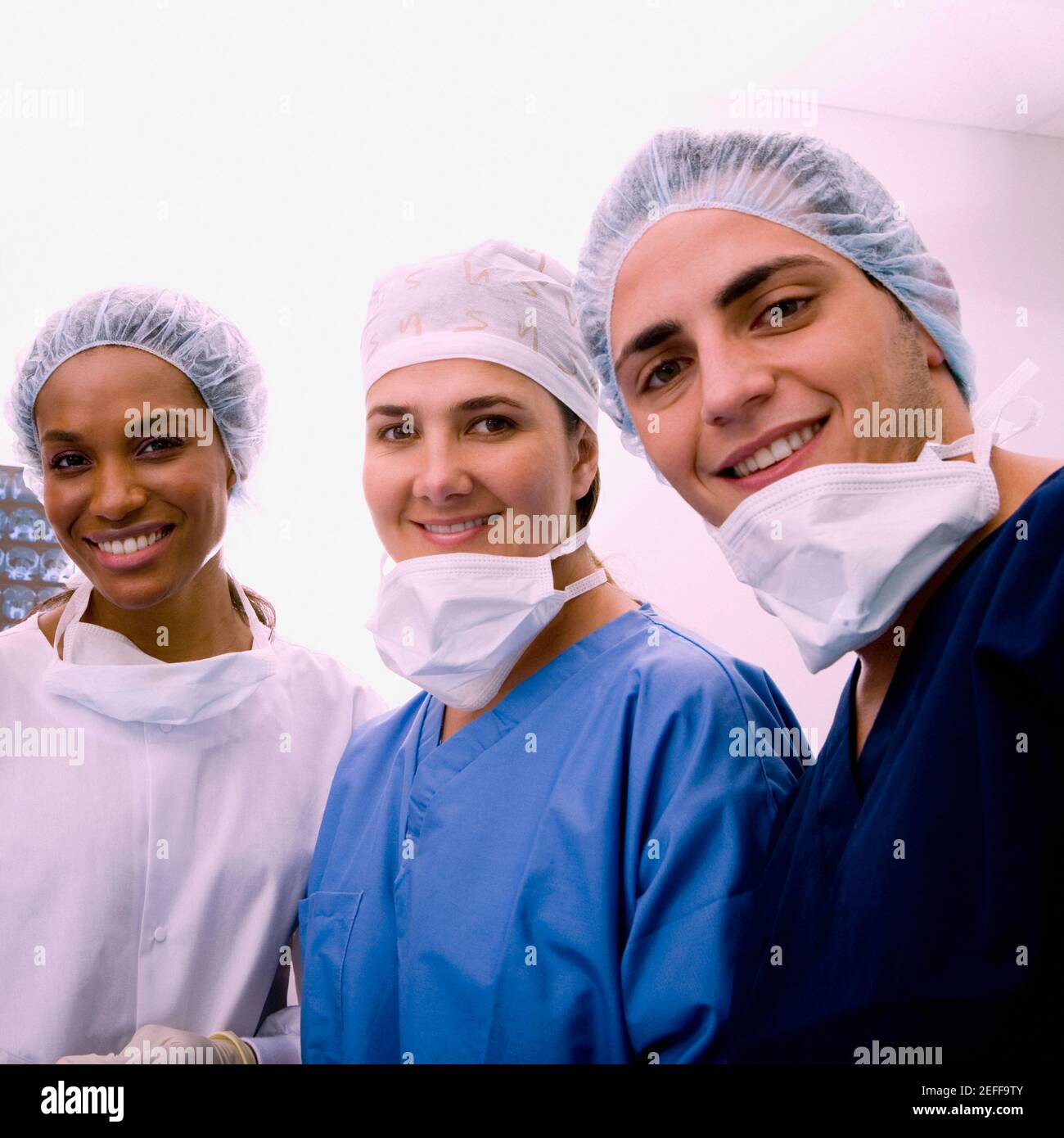 Portrait of a male surgeon and two female surgeons smiling Stock Photo ...