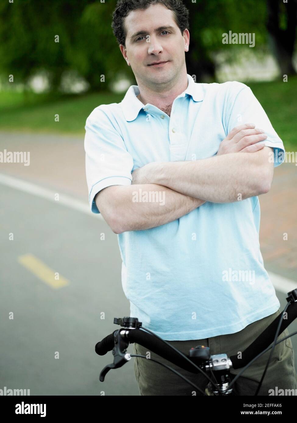 Adult man standing with bicycle hi-res stock photography and images - Alamy