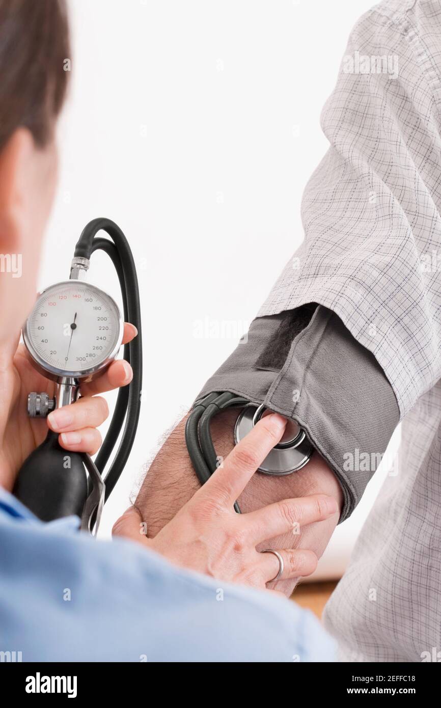 Human hand holding blood pressure gauge hi-res stock photography and ...