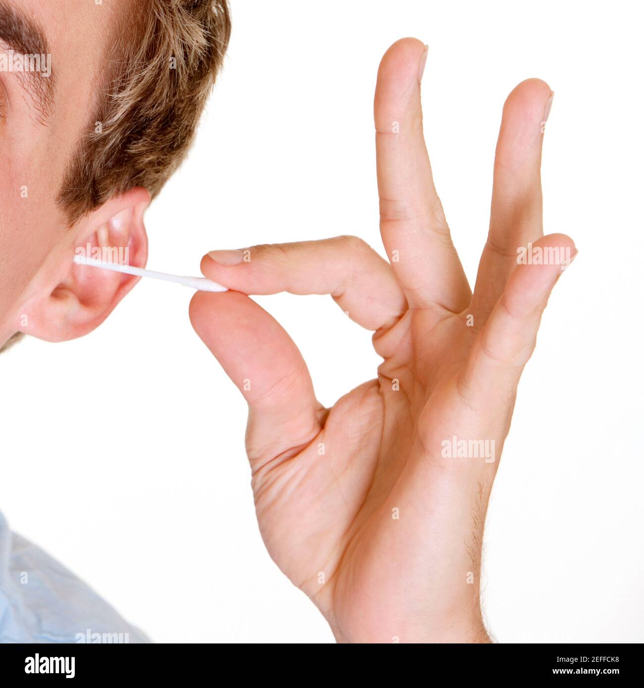 Young man cleaning ear close up hi-res stock photography and images - Alamy
