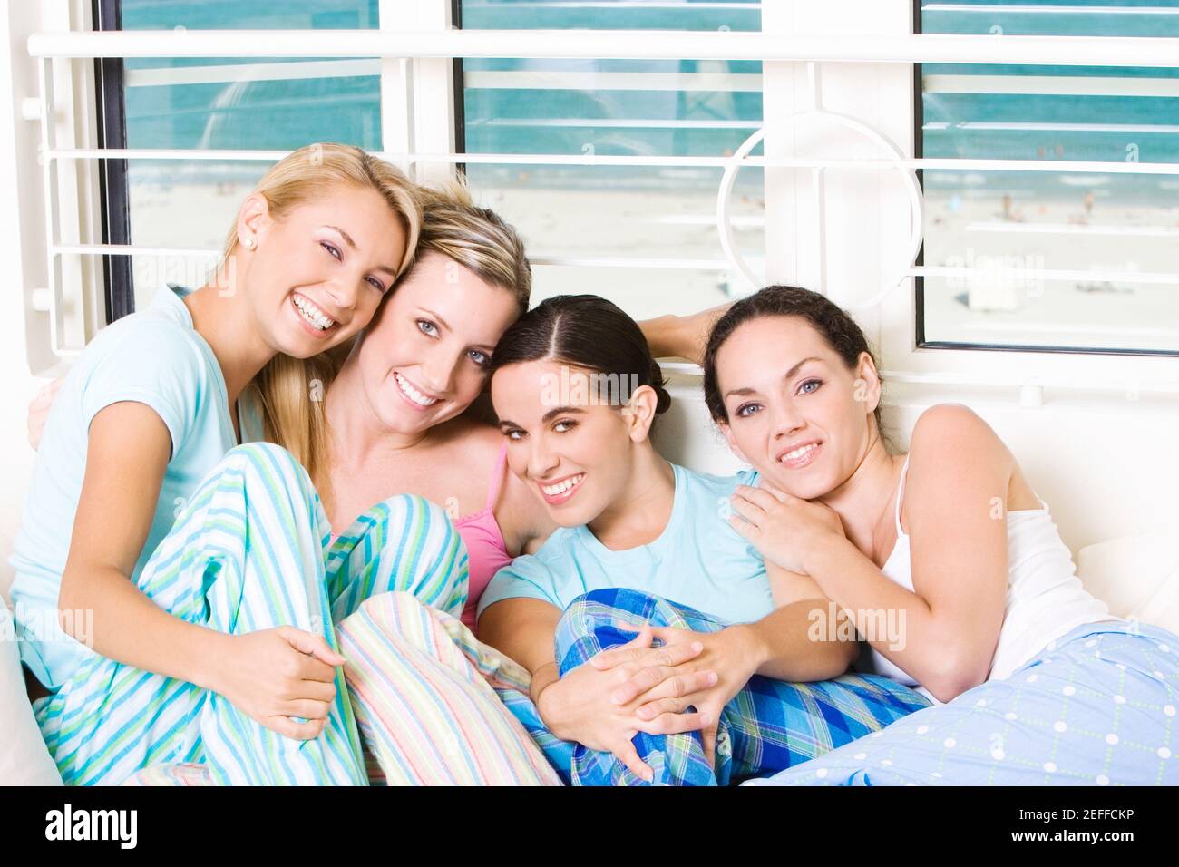 Three reclining young women hi-res stock photography and images - Alamy