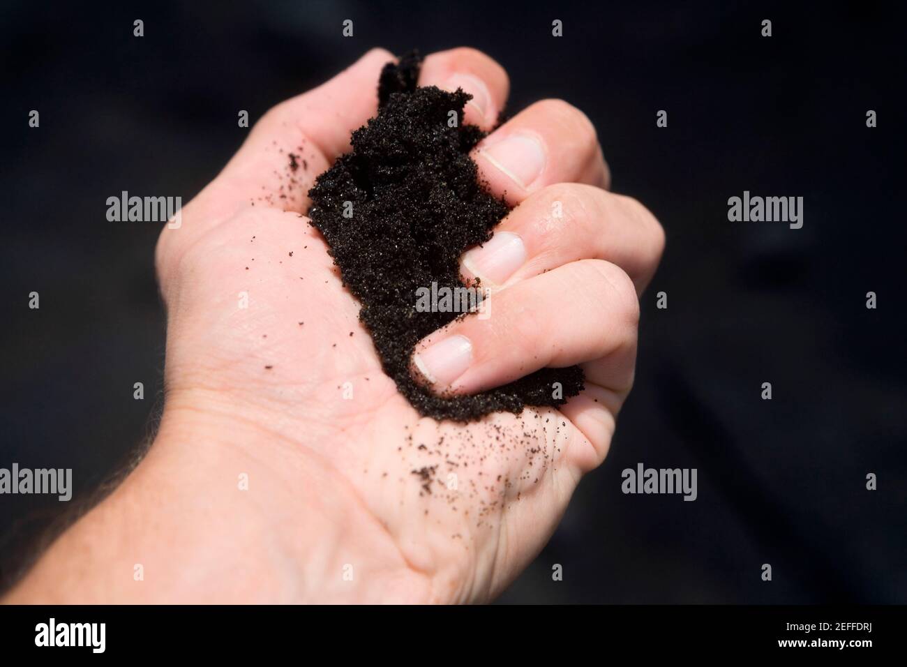 Hand holding dirt hi-res stock photography and images - Alamy