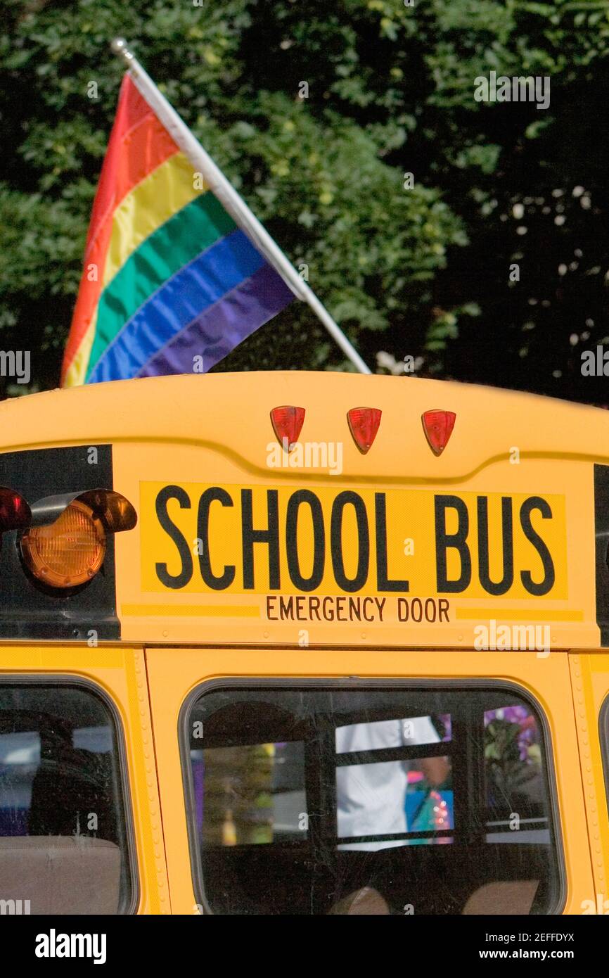 Gay pride flag on the top of a school bus Stock Photo - Alamy