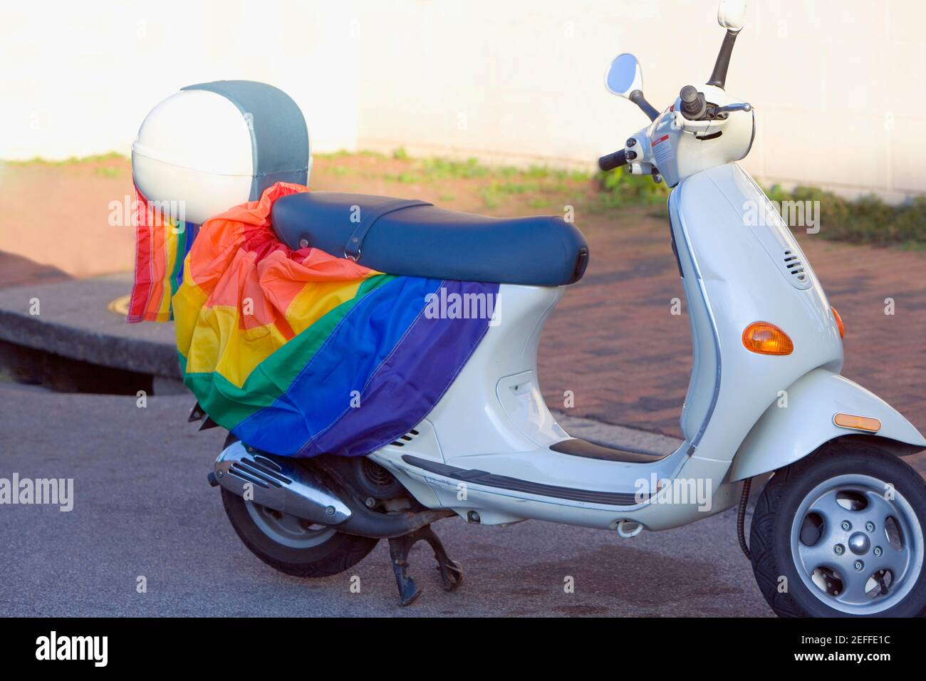 Gay pride flag on a moped parked on a path Stock Photo - Alamy