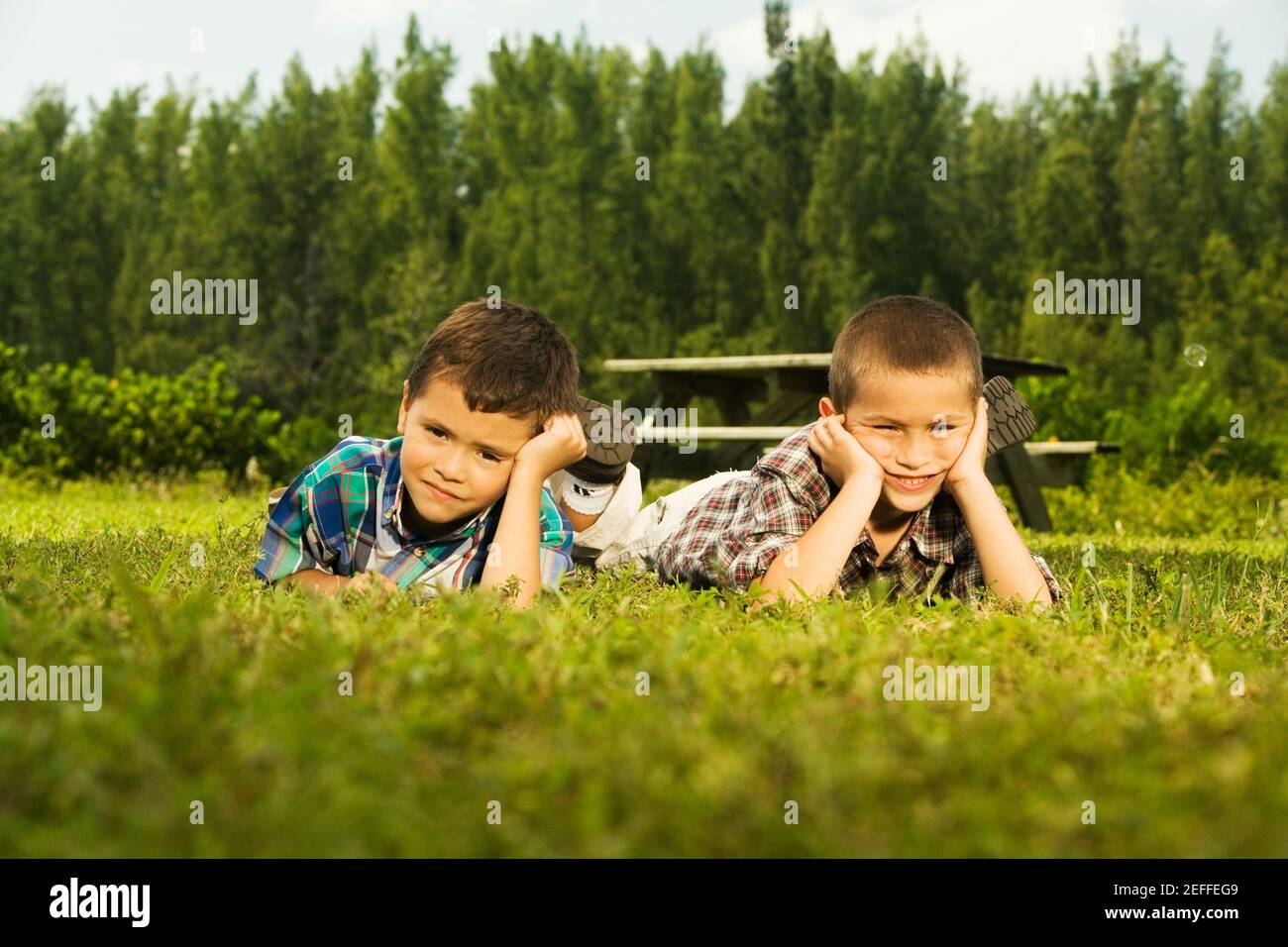 Boy lying down on bench hi-res stock photography and images - Alamy