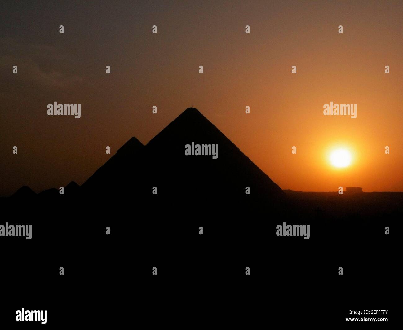Silhouette of pyramids at sunset, Giza Pyramids, Giza, Cairo, Egypt ...