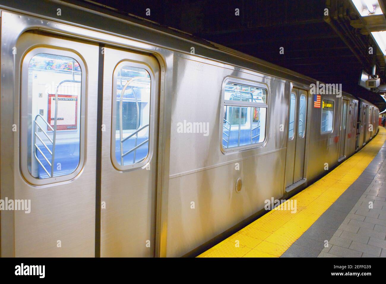 Subway train at a subway platform Stock Photo - Alamy