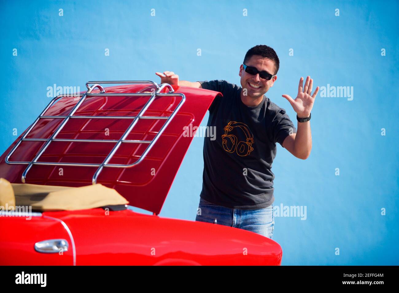 Man standing behind car hi-res stock photography and images - Alamy