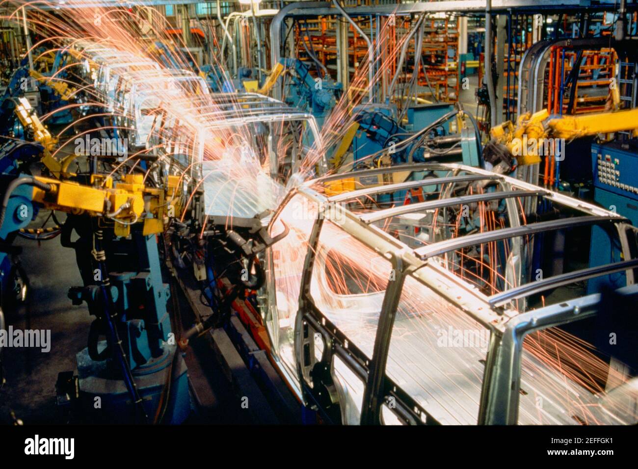 Robots weld van bodies at GM plant, Baltimore, Maryland Stock Photo - Alamy