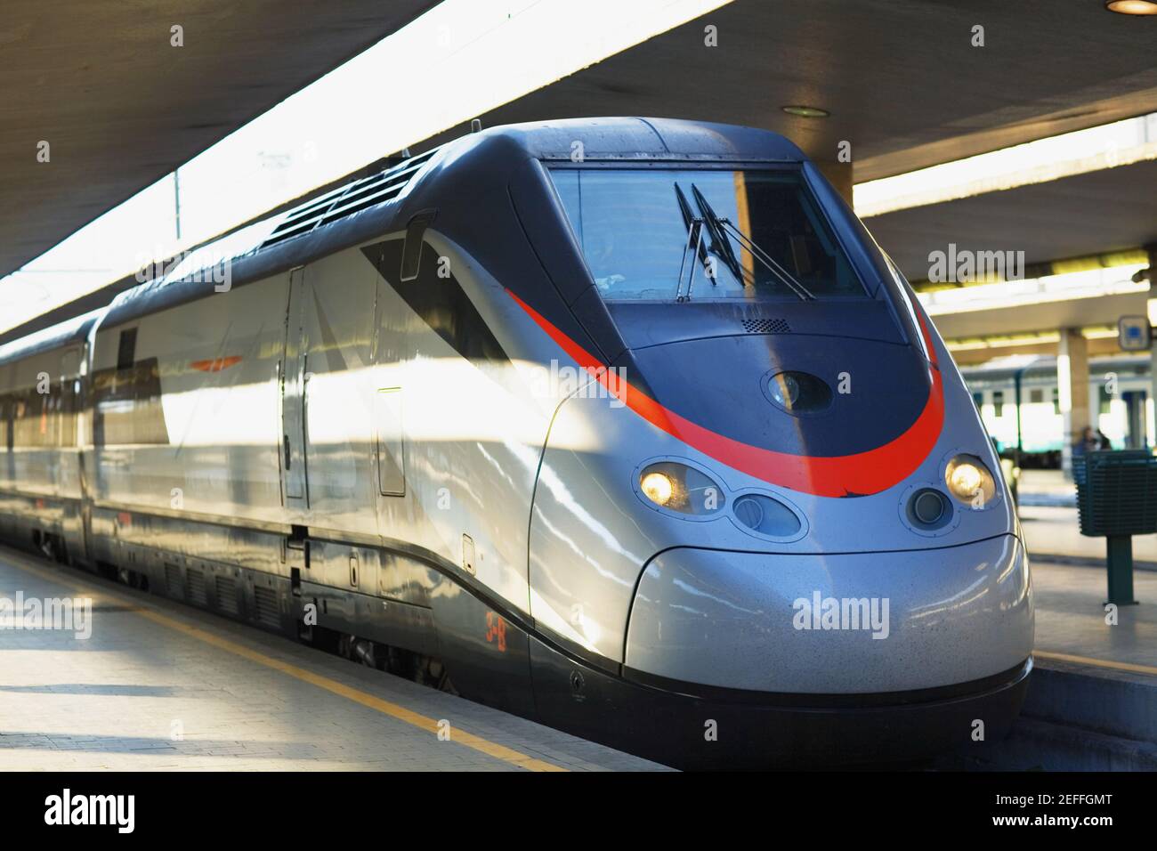 Train at a railroad station platform, Rome, Italy Stock Photo - Alamy