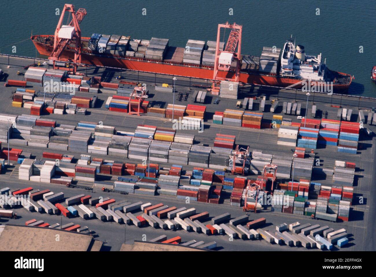Container trailers waiting to be loaded onto a ship Stock Photo - Alamy