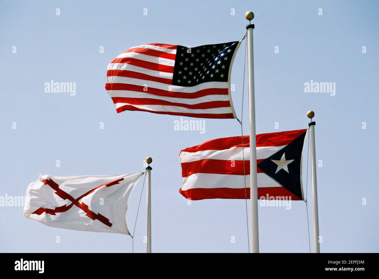 Front view of three fluttering flags, El Morro Fort, San Juan, Puerto ...