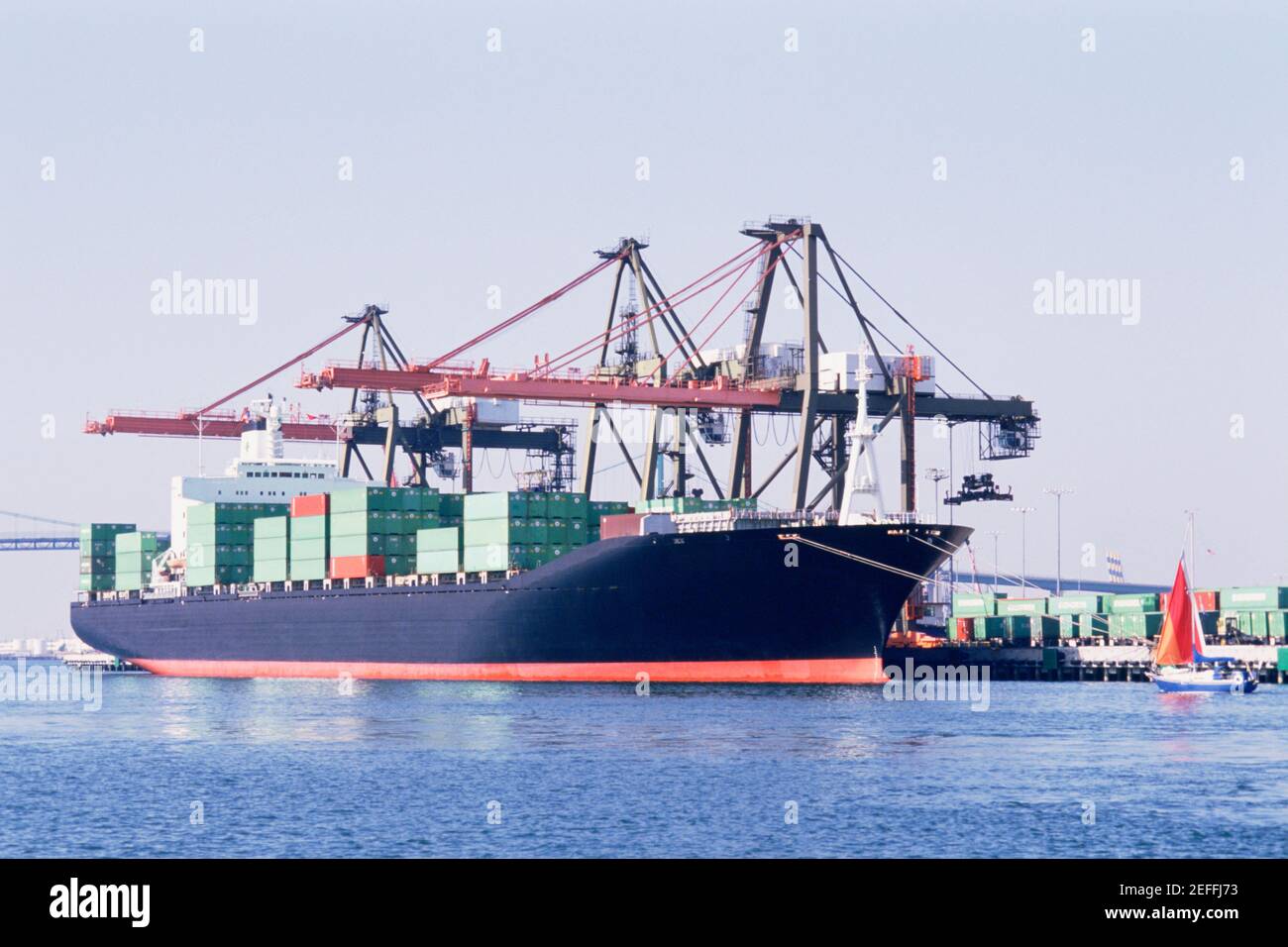 Container ship being loaded at the dock Stock Photo - Alamy