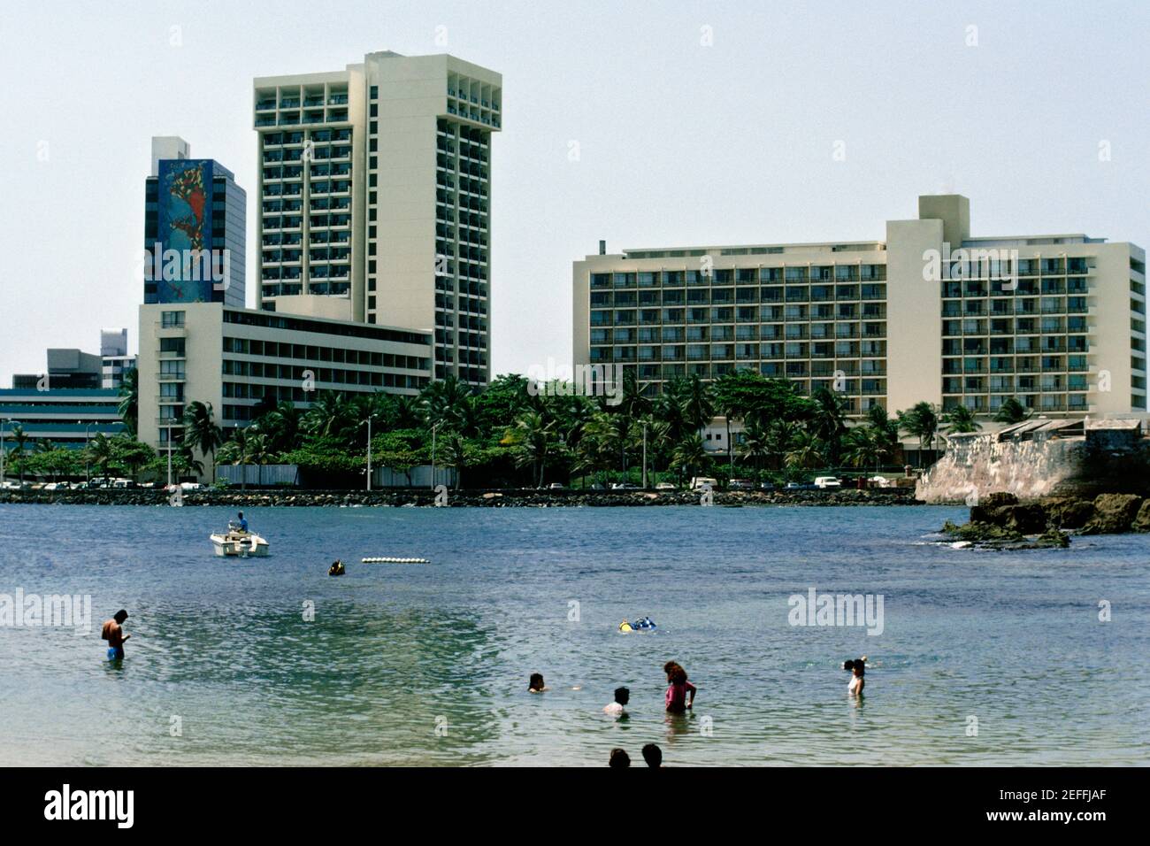 Side view of commercial buildings with a lake in the foreground, San ...