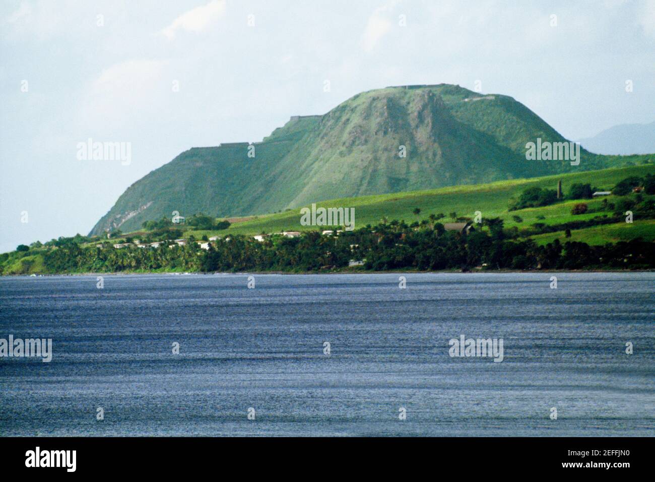 Side view of a lush mountain from a vast sea, St. Kitts, Leeward ...
