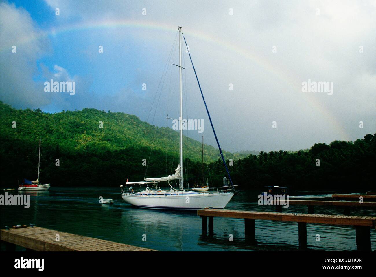 Rainbow is seen over a harbor, St. Lucia, Caribbean Stock Photo - Alamy