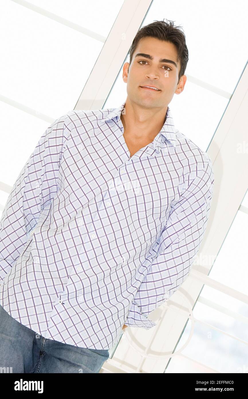 Portrait of a young man standing Stock Photo - Alamy