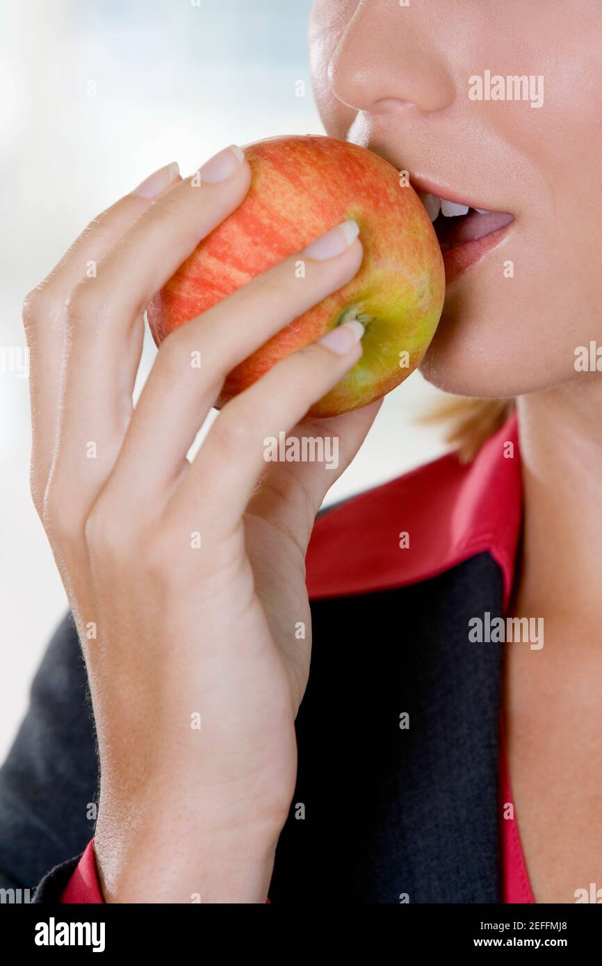 Mouth biting apple hi-res stock photography and images - Alamy