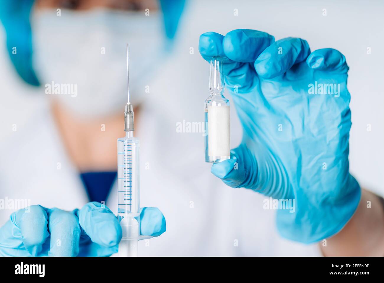 Syringe and ampule, bottle, medical injection in hand, palm or fingers ...