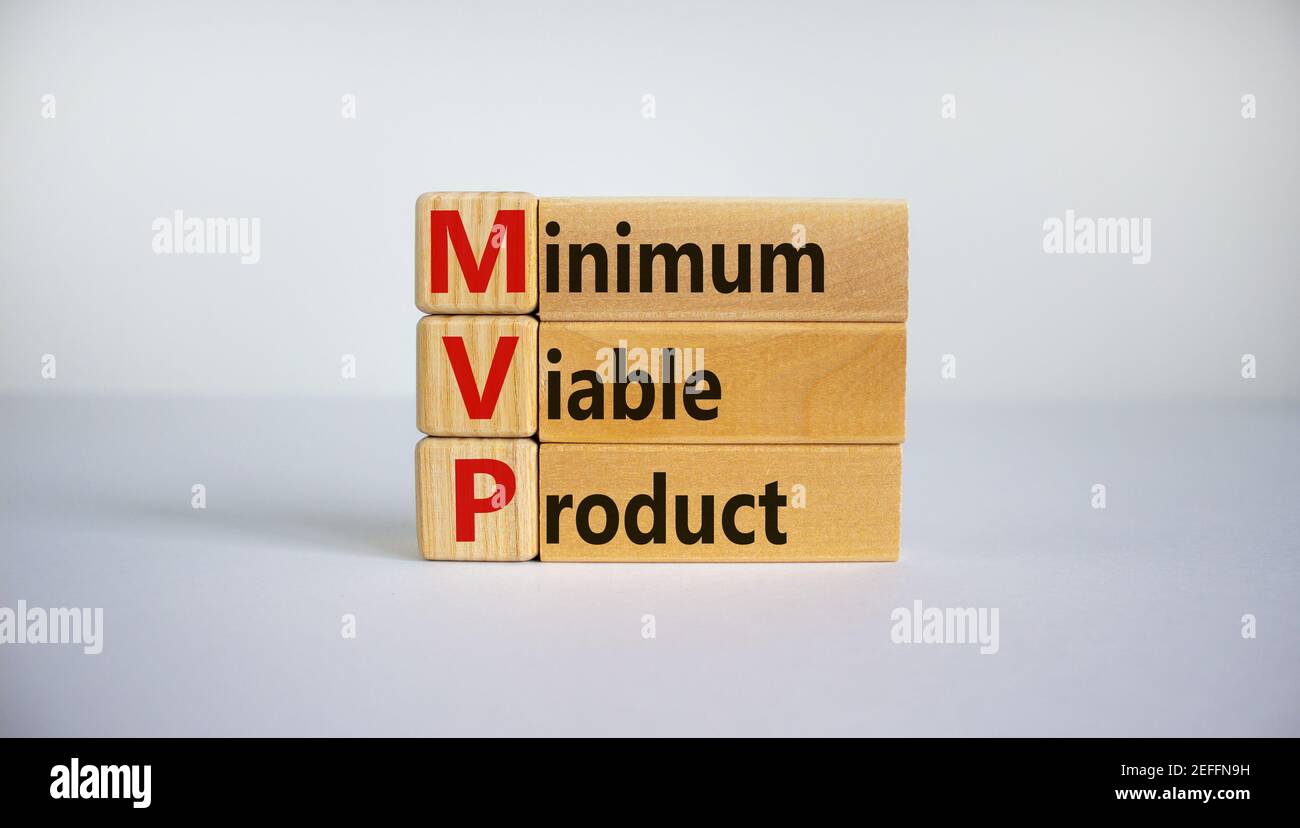 MVP, minimum viable product symbol. Wooden cubes and blocks with words ...