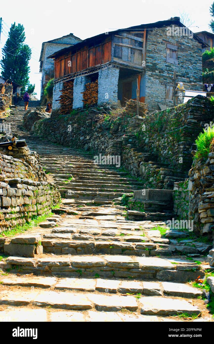 Low angle view of houses in a town, Tadapani, Annapurna Range ...