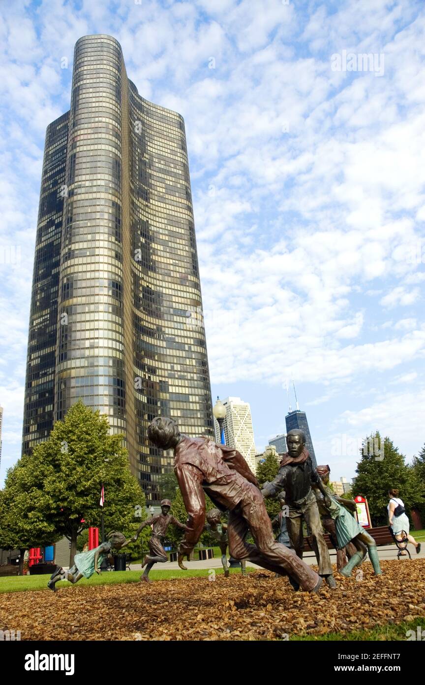 Sculptures in front of a tower, Lake Point Tower, Chicago, Illinois ...
