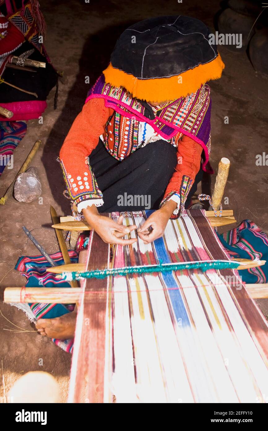 Woman weaving in a loom, Aguanacancha, Peru Stock Photo - Alamy