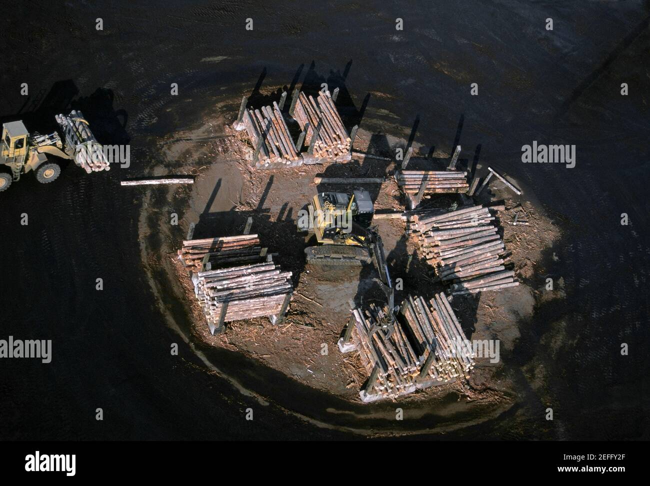 Sawmill log handler at work, Idaho Stock Photo - Alamy