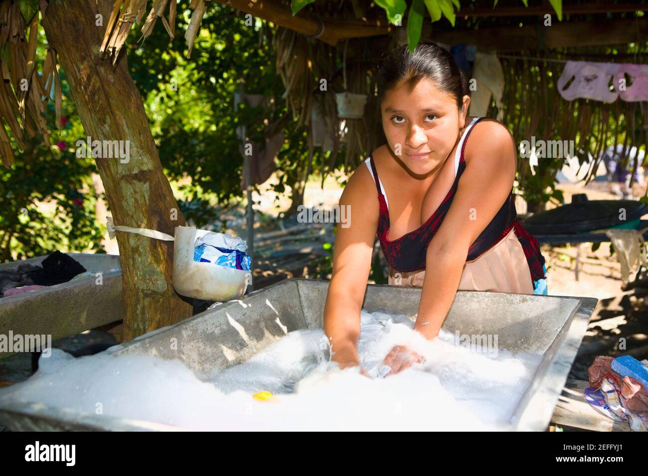 Portrait of a young woman washing clothes, Papantla, Veracruz, Mexico ...