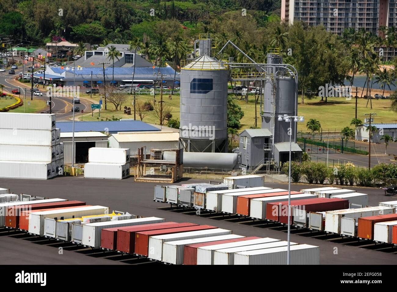 High angle view of cargo containers and a storage tank at a commercial ...