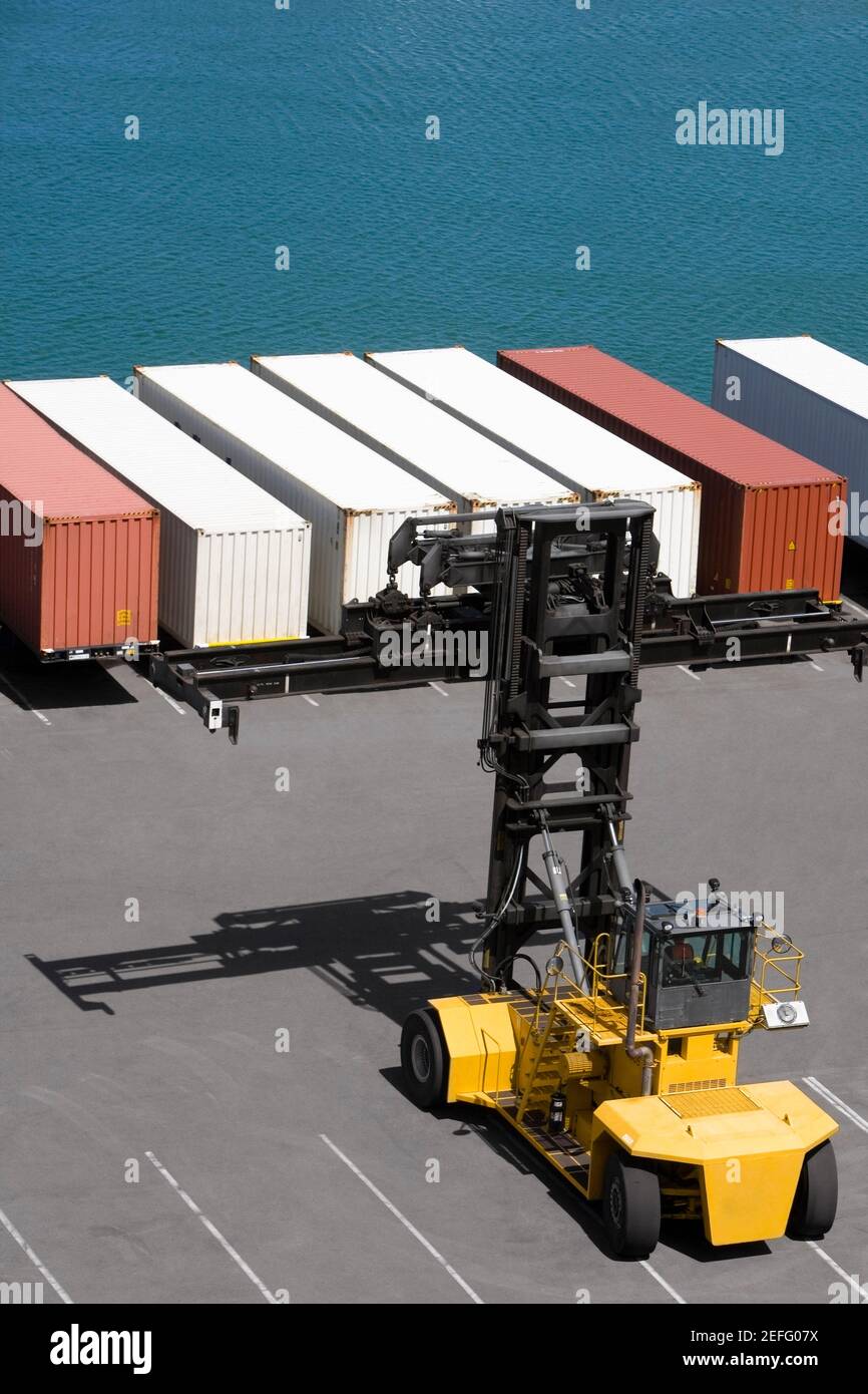 High angle view of a forklift with cargo containers at a commercial ...