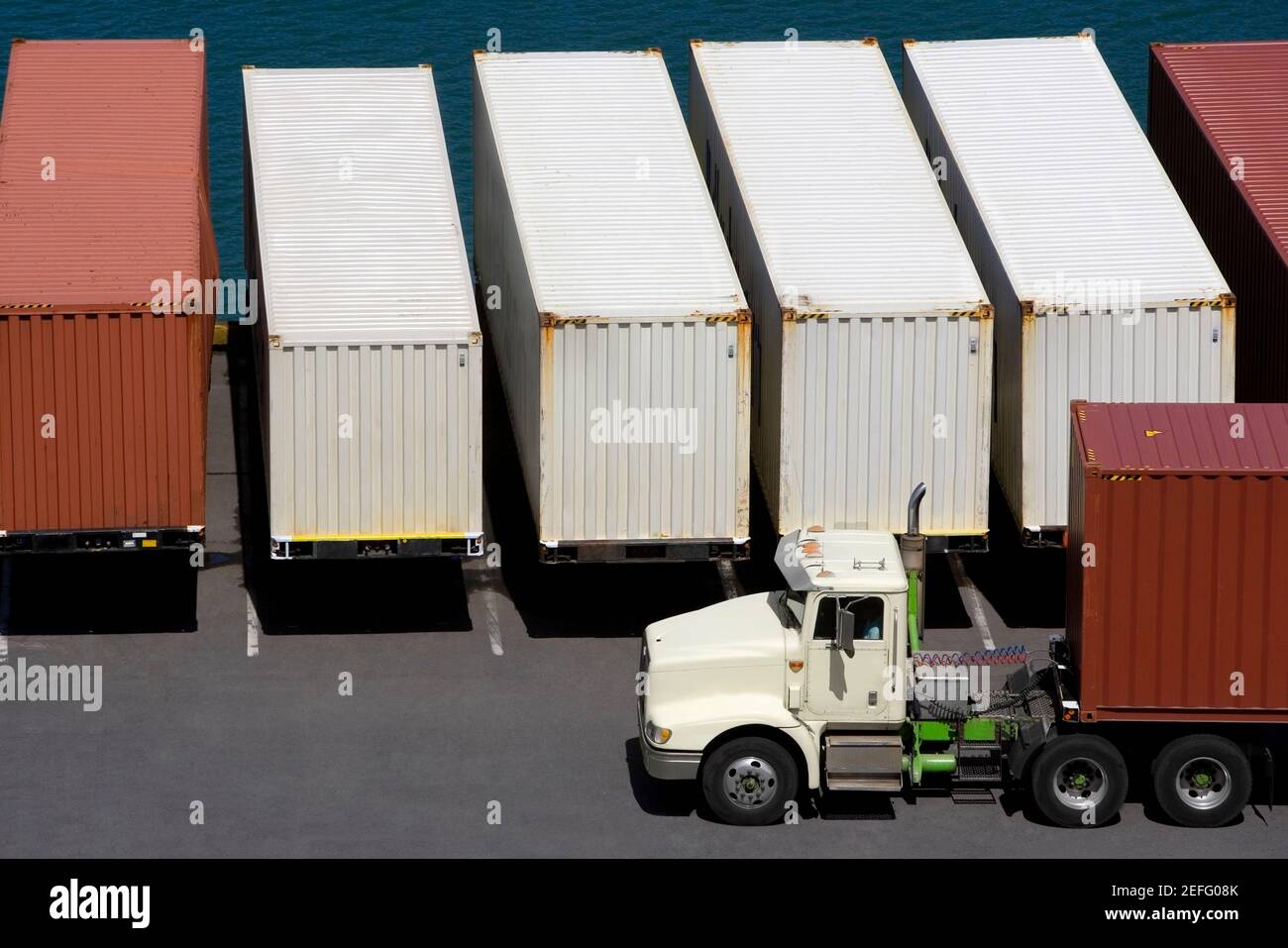 High angle view of a semi-truck with cargo containers at a commercial ...