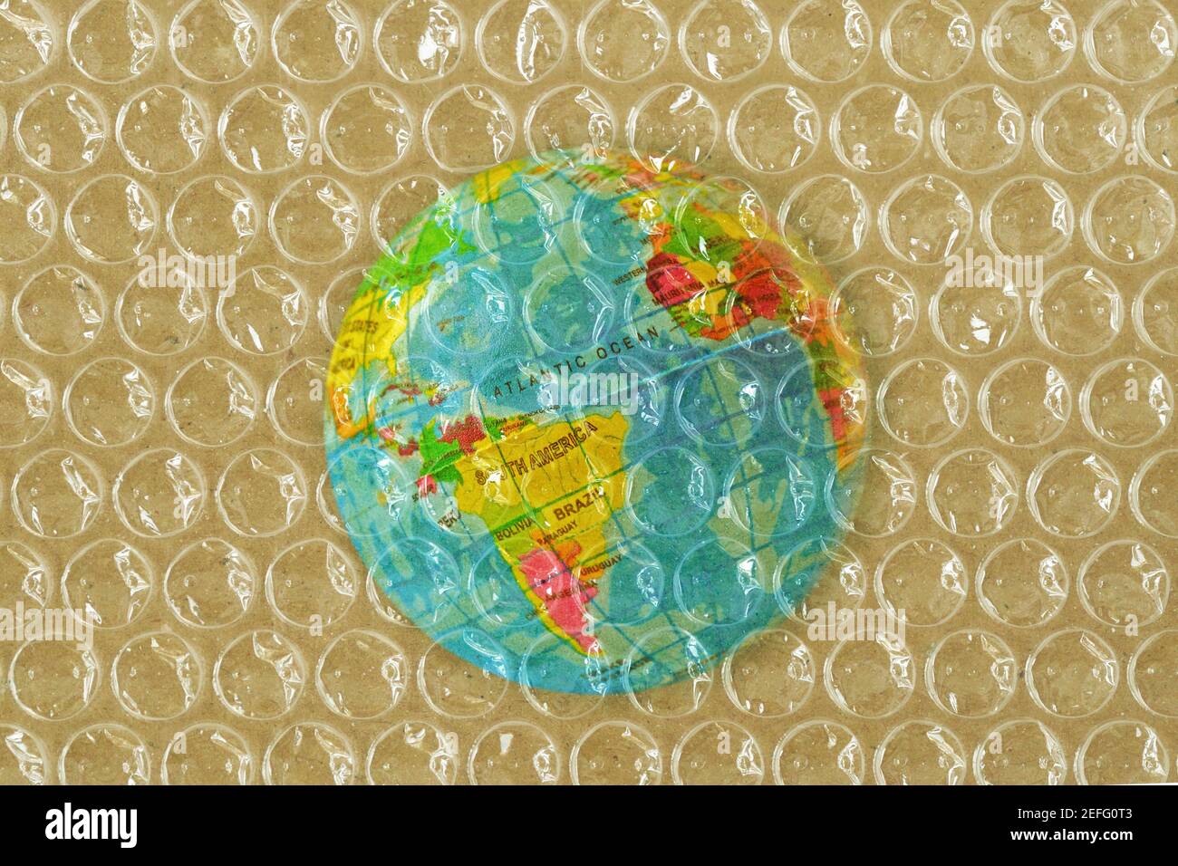 Planet earth under plastic bubble wrap - Concept of plastic pollution ...