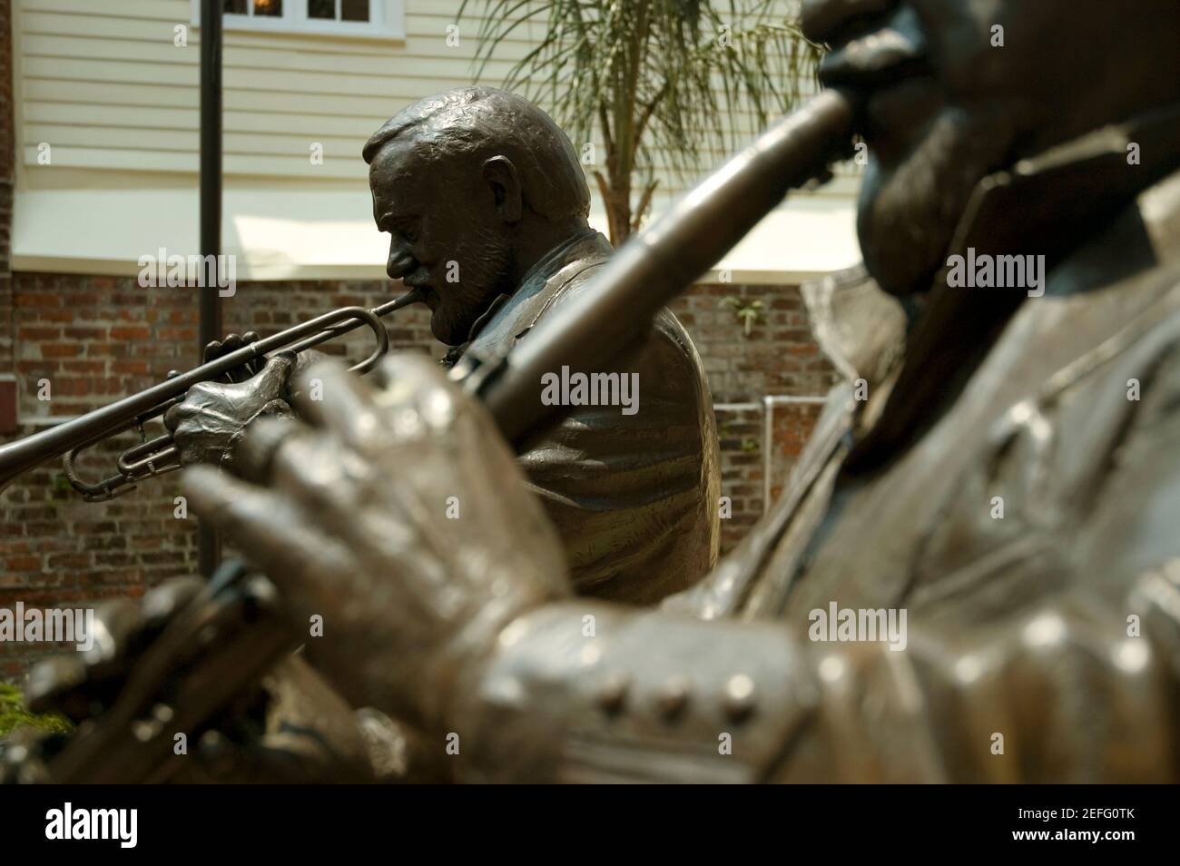 Close-up of statues of two musicians playing musical instruments, New ...