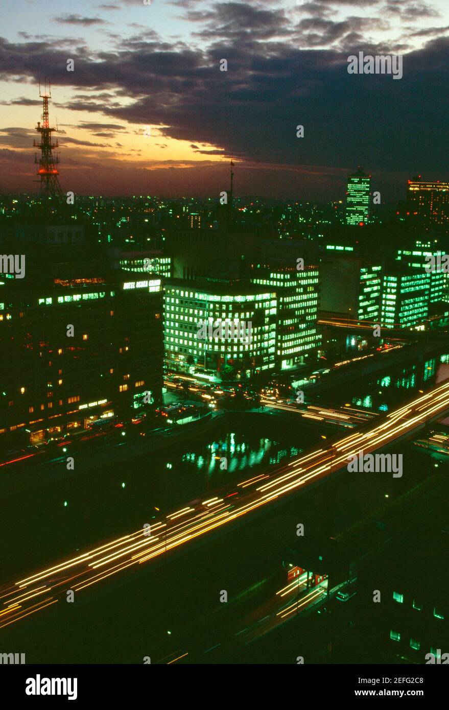 Aerial view of skyscrapers lit up at night, Osaka, Japan Stock Photo ...