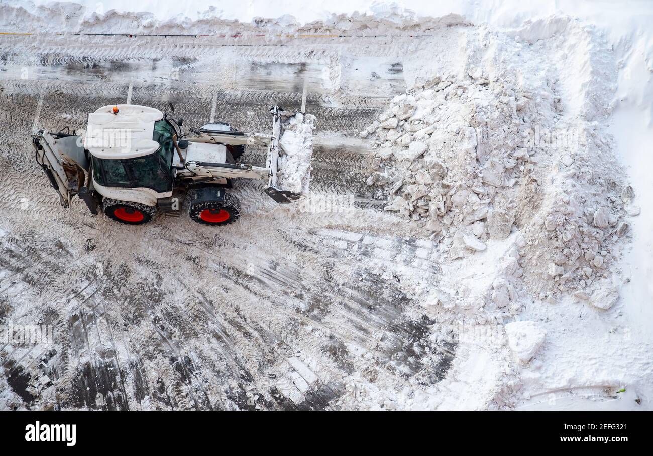 Snow removal excavator truck, Drone top view Stock Photo - Alamy
