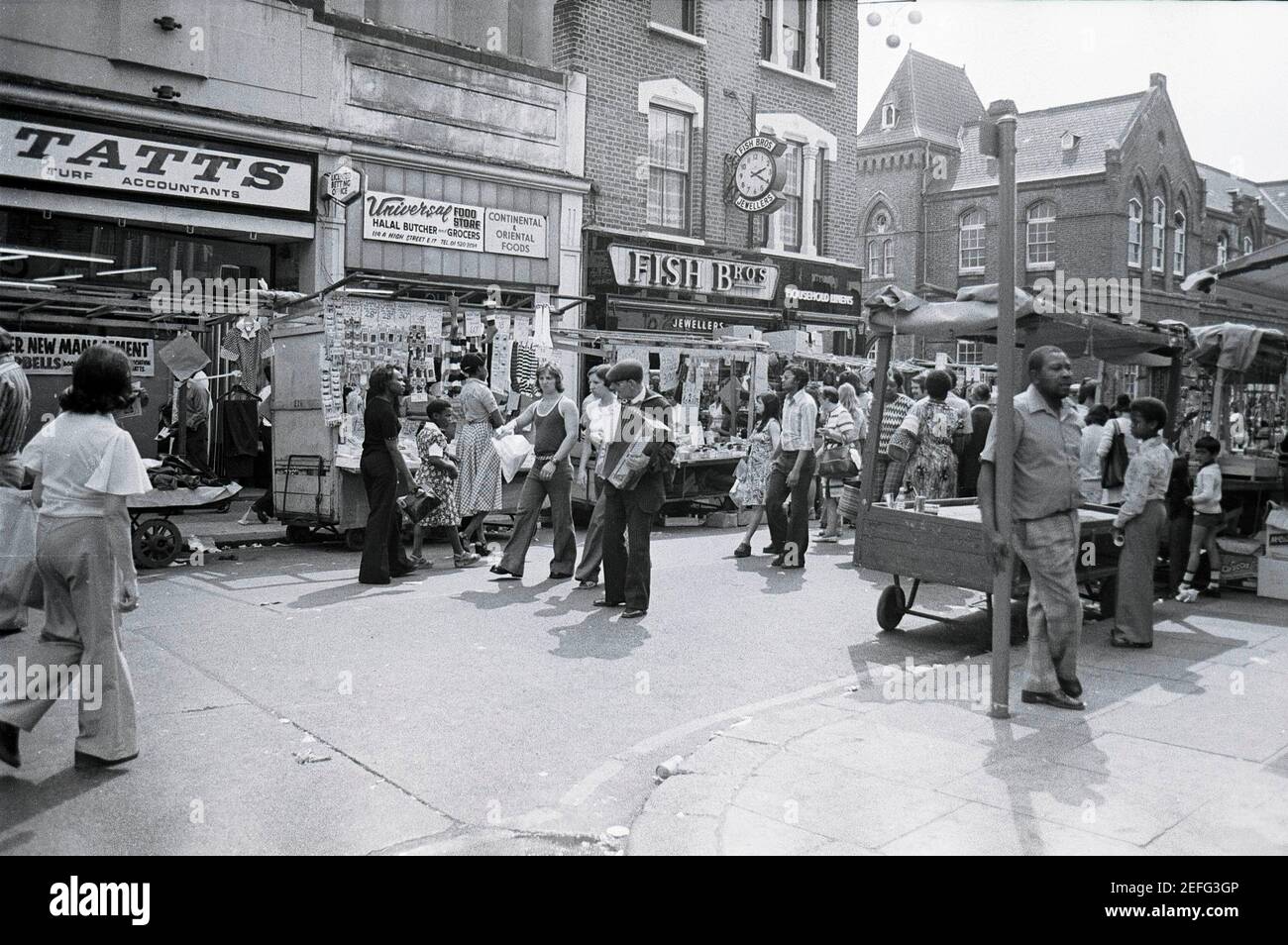 Walthamstow High Street Market with stalls and customers London 1977 ...