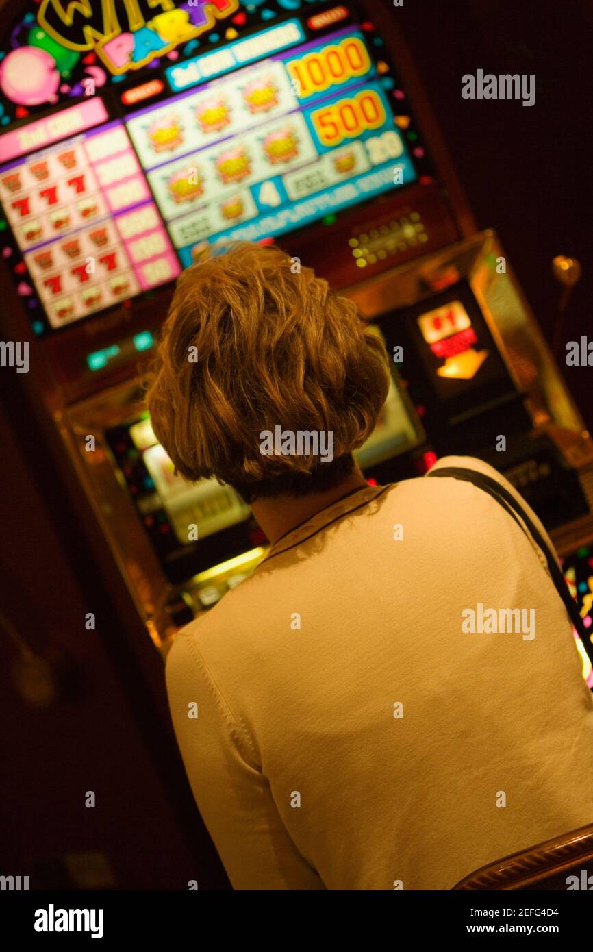 Sitting at betting machine hi-res stock photography and images - Alamy