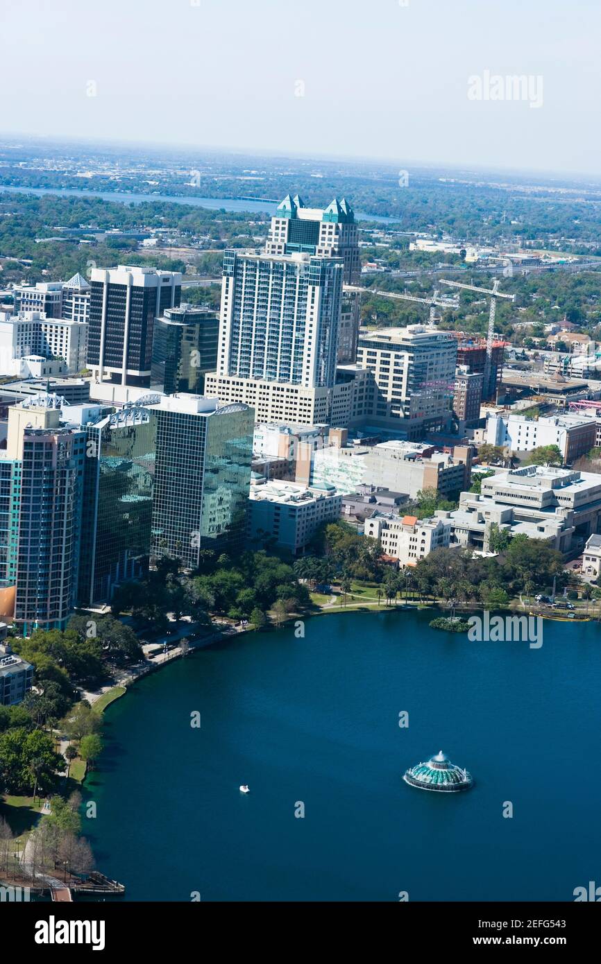 Aerial view of buildings along a lake, Lake Eola, Lake Eola Park ...