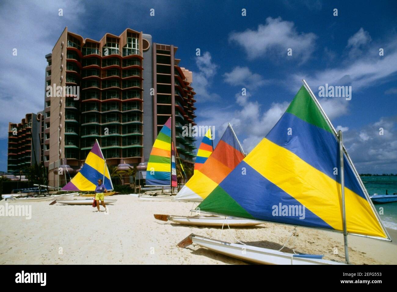Colorful sailboats on a beach at Crystal Palace Hotel, Nassau, Bahamas ...