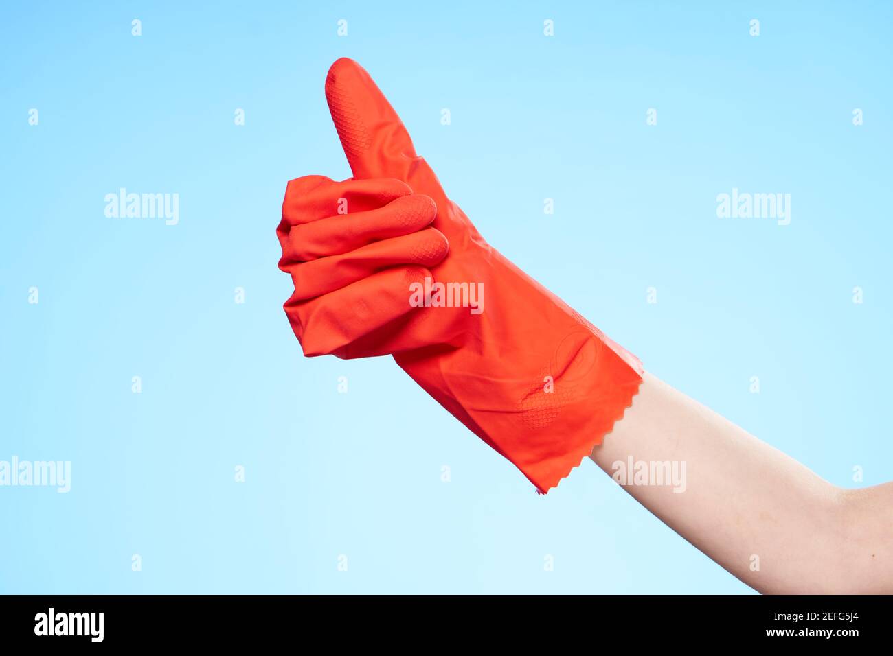 hand in red rubber gloves gesturing blue background cleaning Stock ...